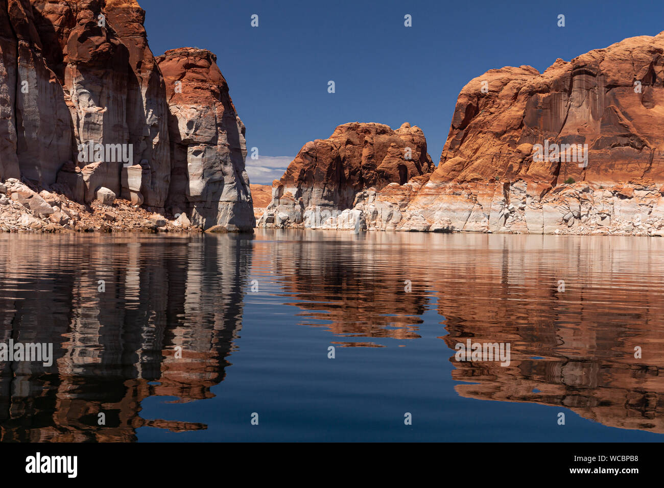 Reflections in Iceberg Canyon on Lake Powell showing the high water ...