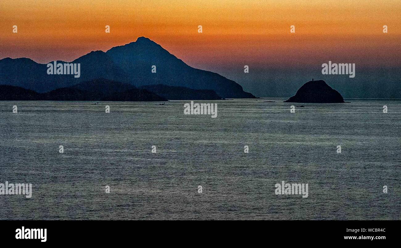 Nagasaki, Kyushu, Japan. 28th Oct, 2006. A colorful dawn lights the sky ...
