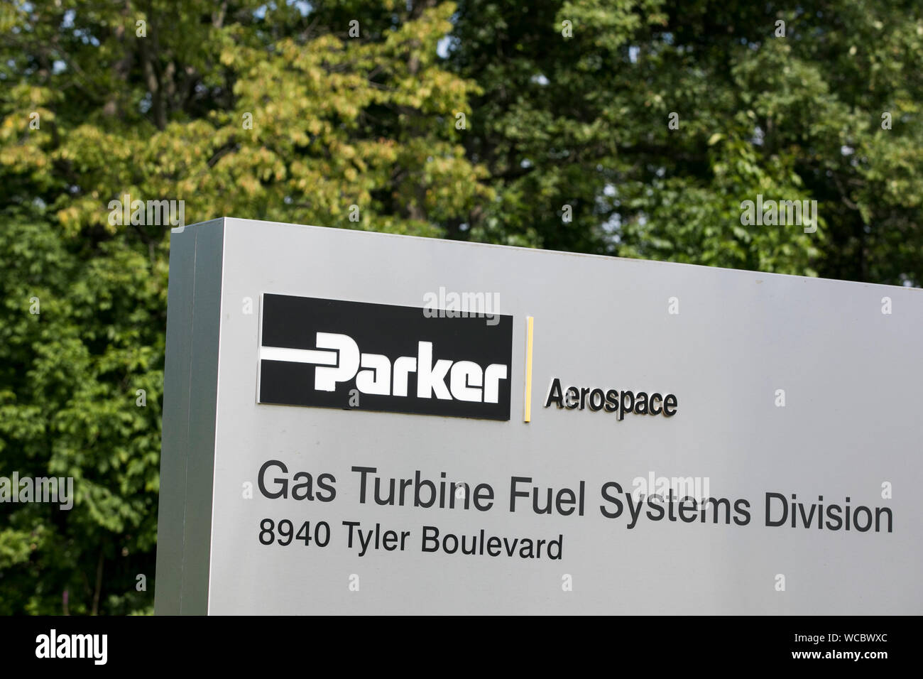 A logo sign outside of a facility occupied by Parker-Hannifin ...