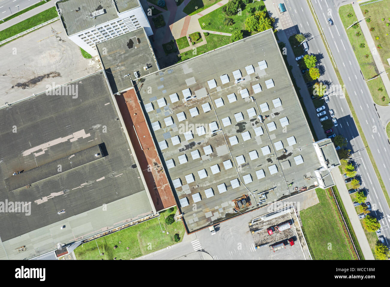 aerial top view of roof of modern industrial building. drone image ...