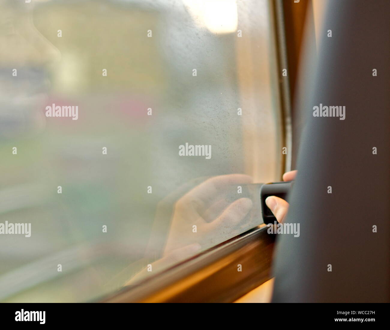 Hand in train window hi-res stock photography and images - Alamy