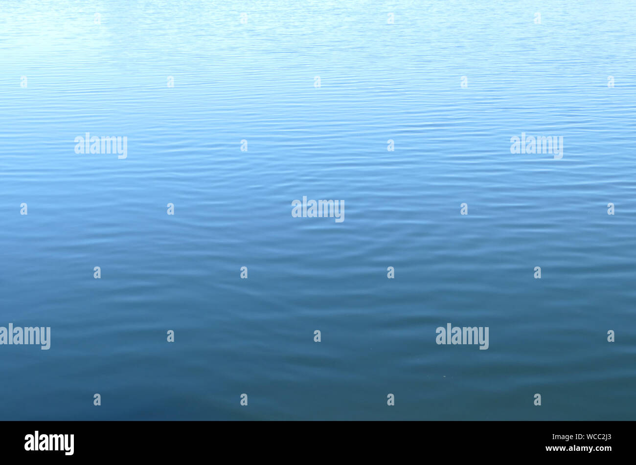 Blue water surface as background Stock Photo - Alamy