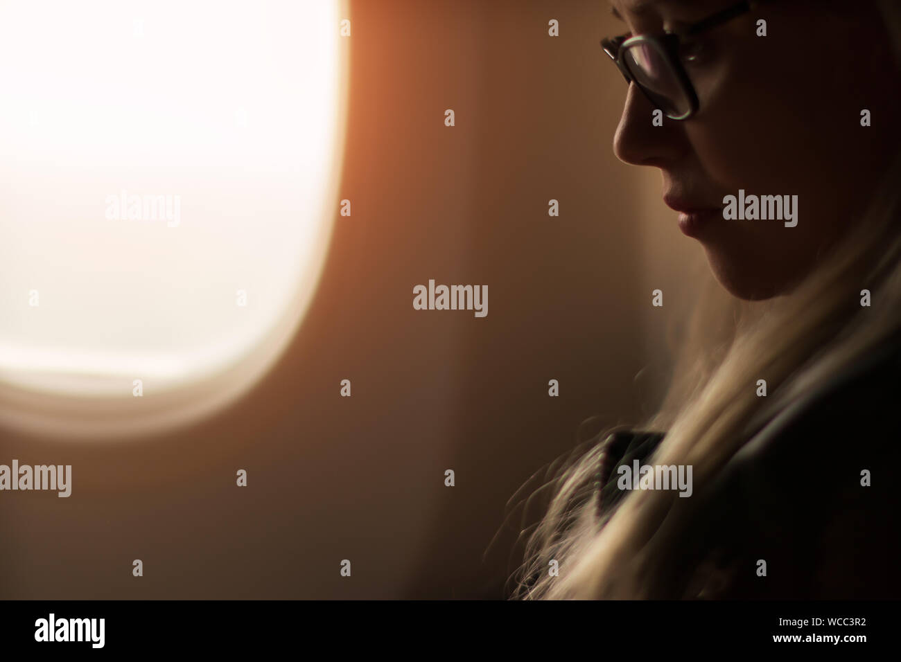 One woman flight window hi-res stock photography and images - Alamy