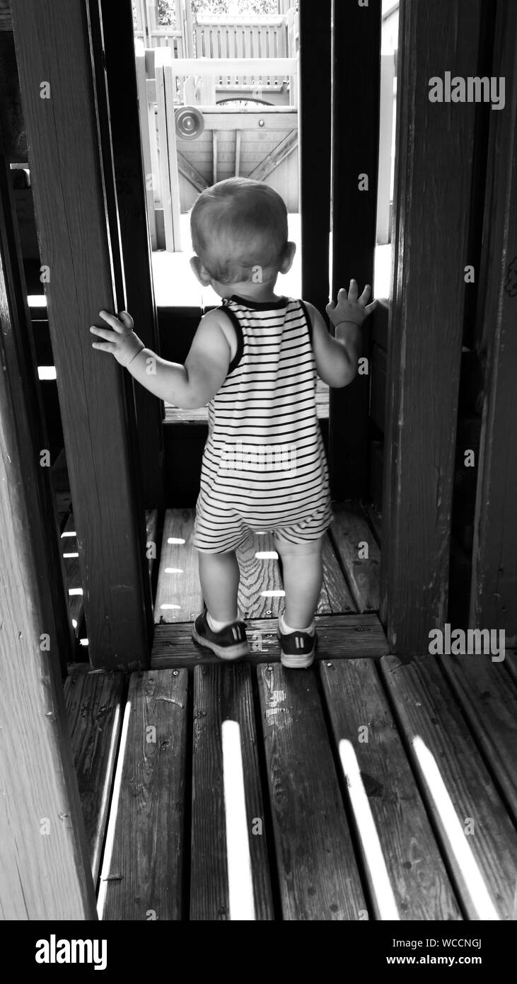 Boy standing rear view Black and White Stock Photos & Images - Alamy