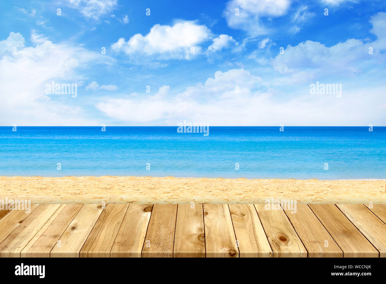 Wood table top on blue sea & sky background Stock Photo - Alamy