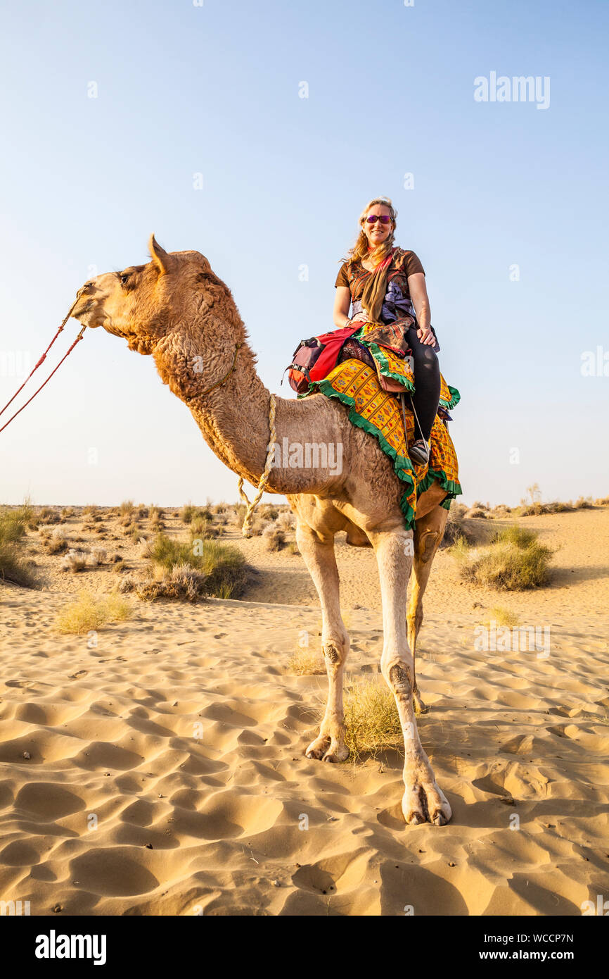 Woman riding camel hi-res stock photography and images - Alamy