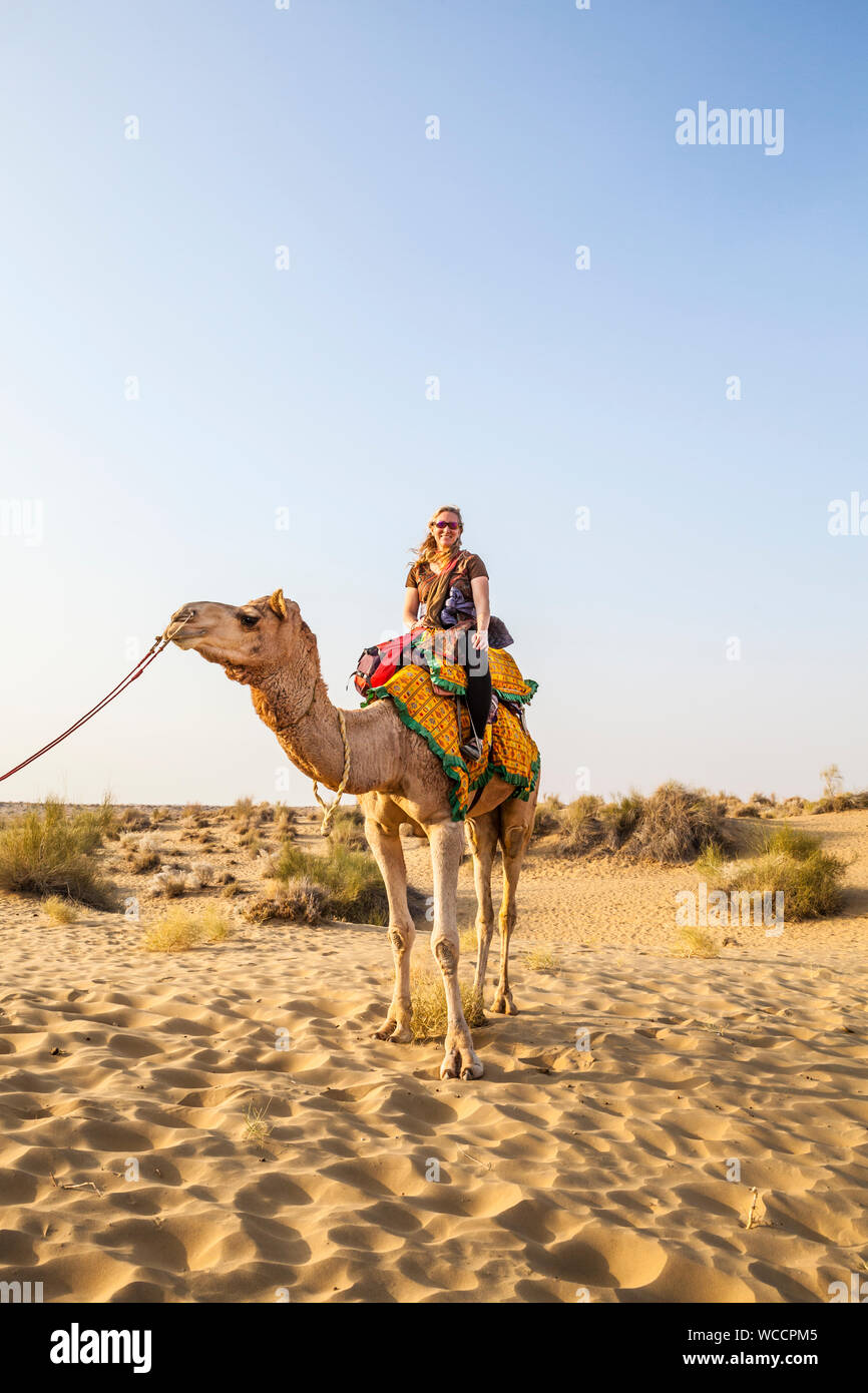 Woman riding camel hi-res stock photography and images - Alamy