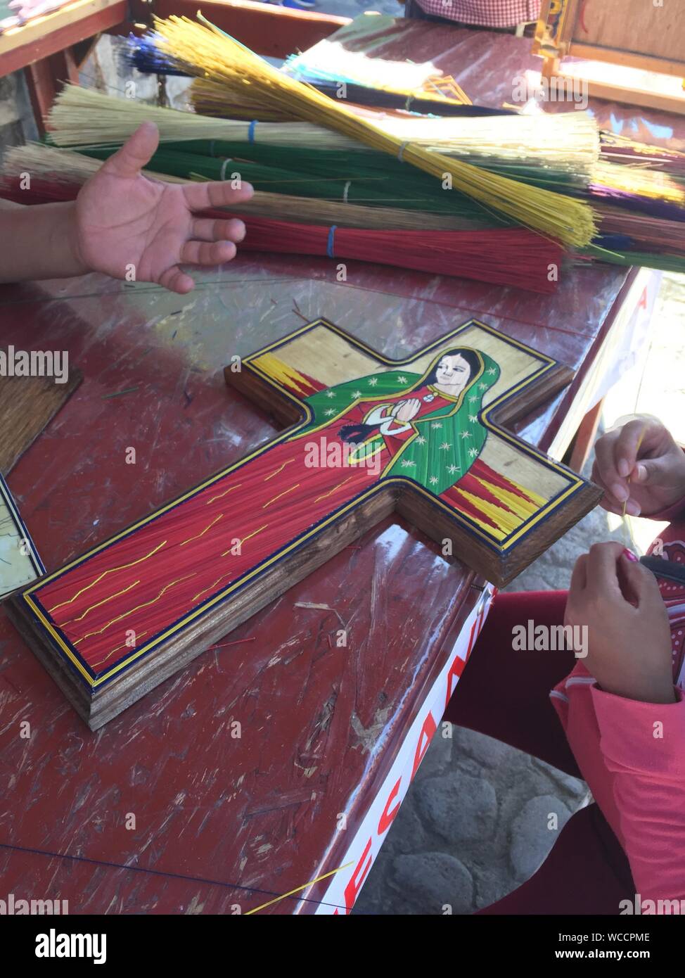 Hands on the cross hi-res stock photography and images - Alamy