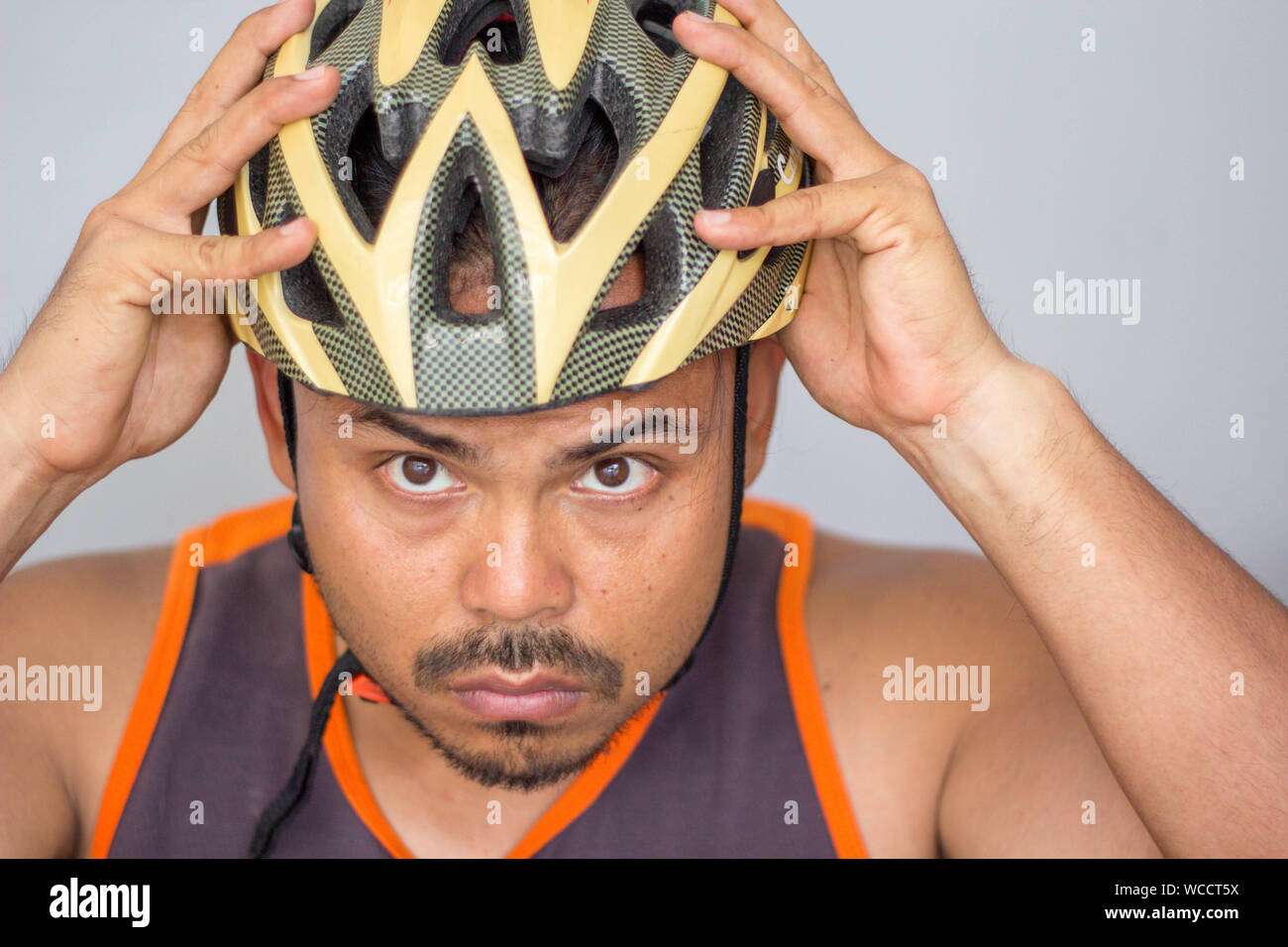 Adjusting Helmet High Resolution Stock Photography and Images - Alamy