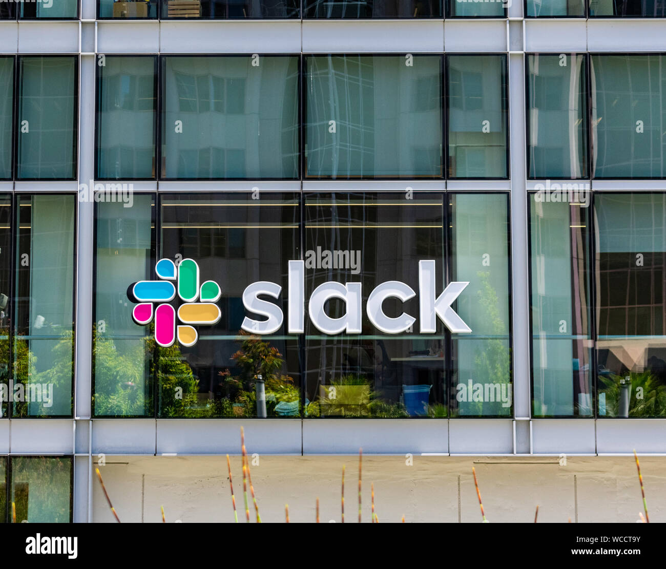 Slack sign and logo on facade of software company headquarters building ...