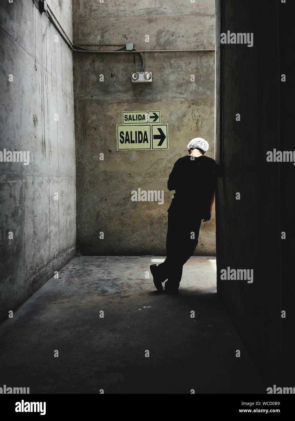 Leaning against sign hi-res stock photography and images - Alamy