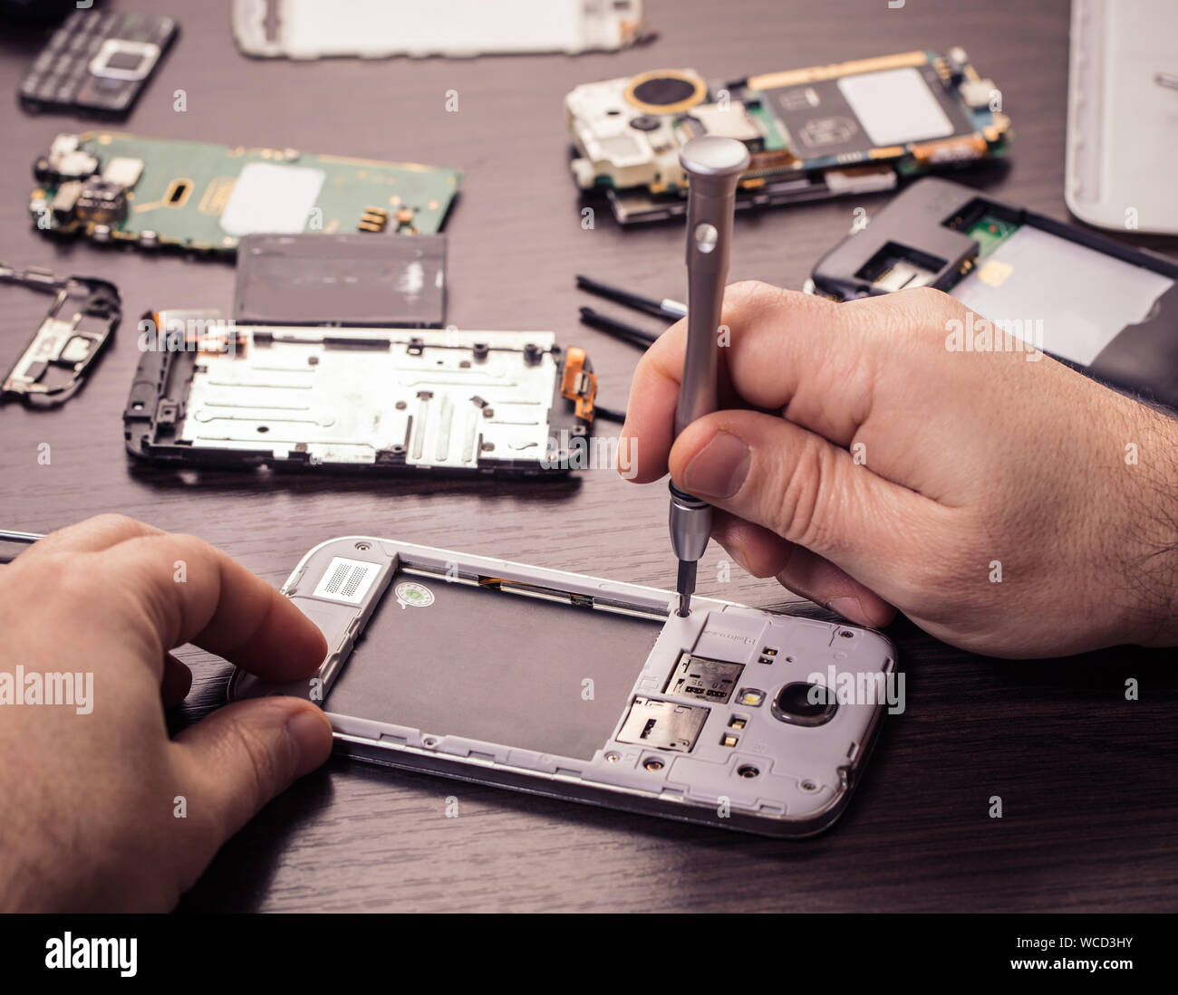 Hands on repair hi-res stock photography and images - Alamy