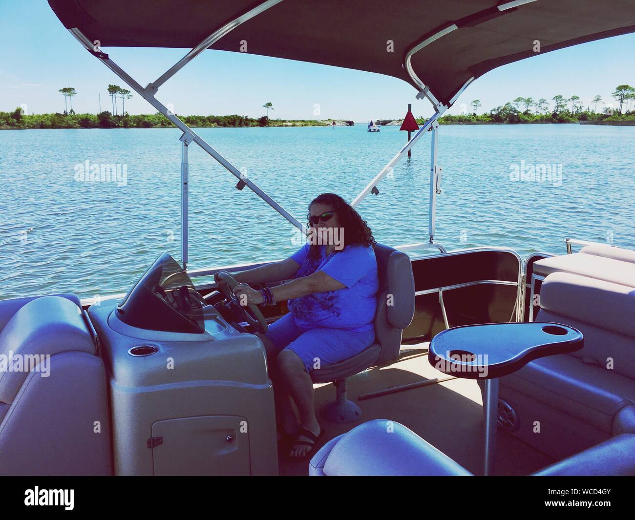 Women driving boat hi-res stock photography and images - Alamy