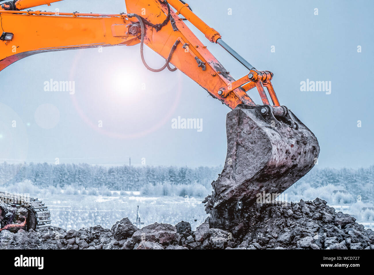 Excavator is loading excavation to the truck. Excavators are heavy ...