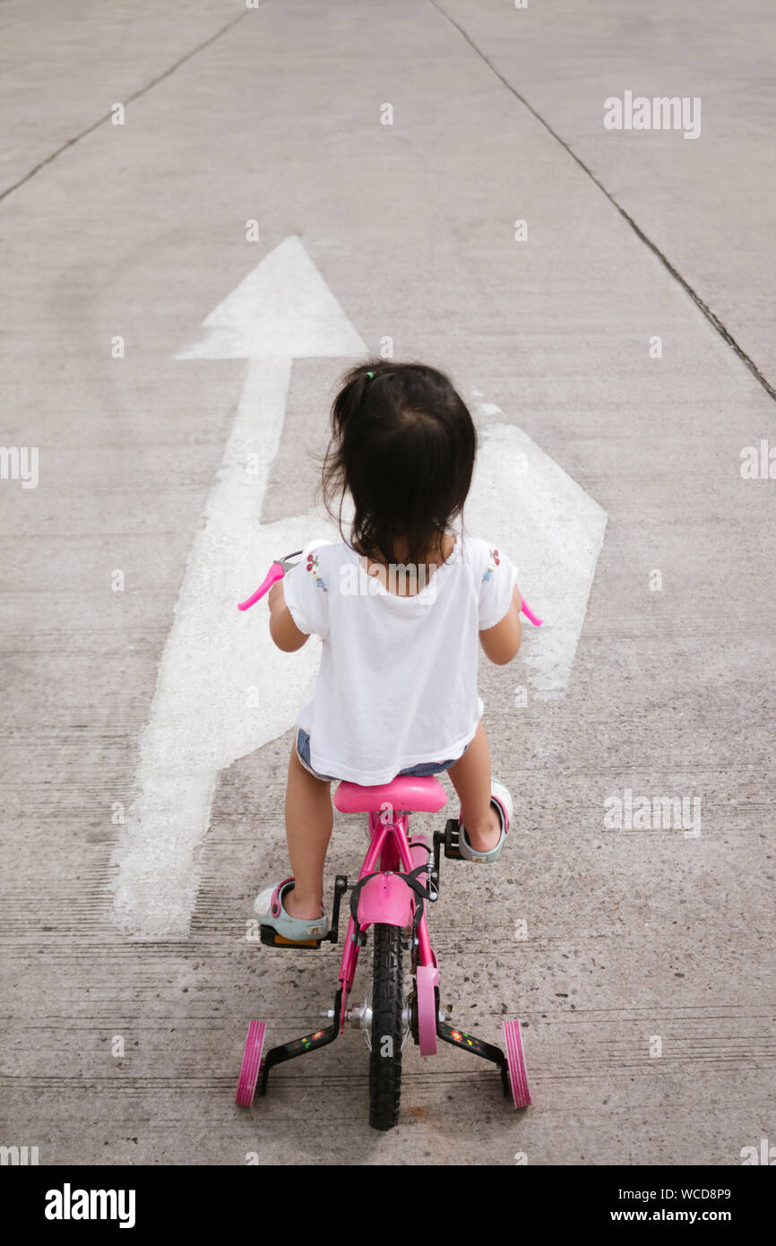 Tricycle riding hi-res stock photography and images - Alamy