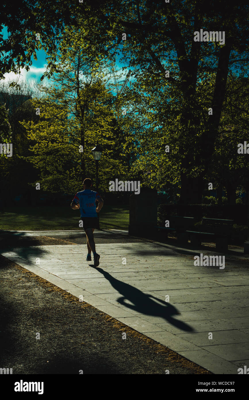 Man running park hi-res stock photography and images - Alamy
