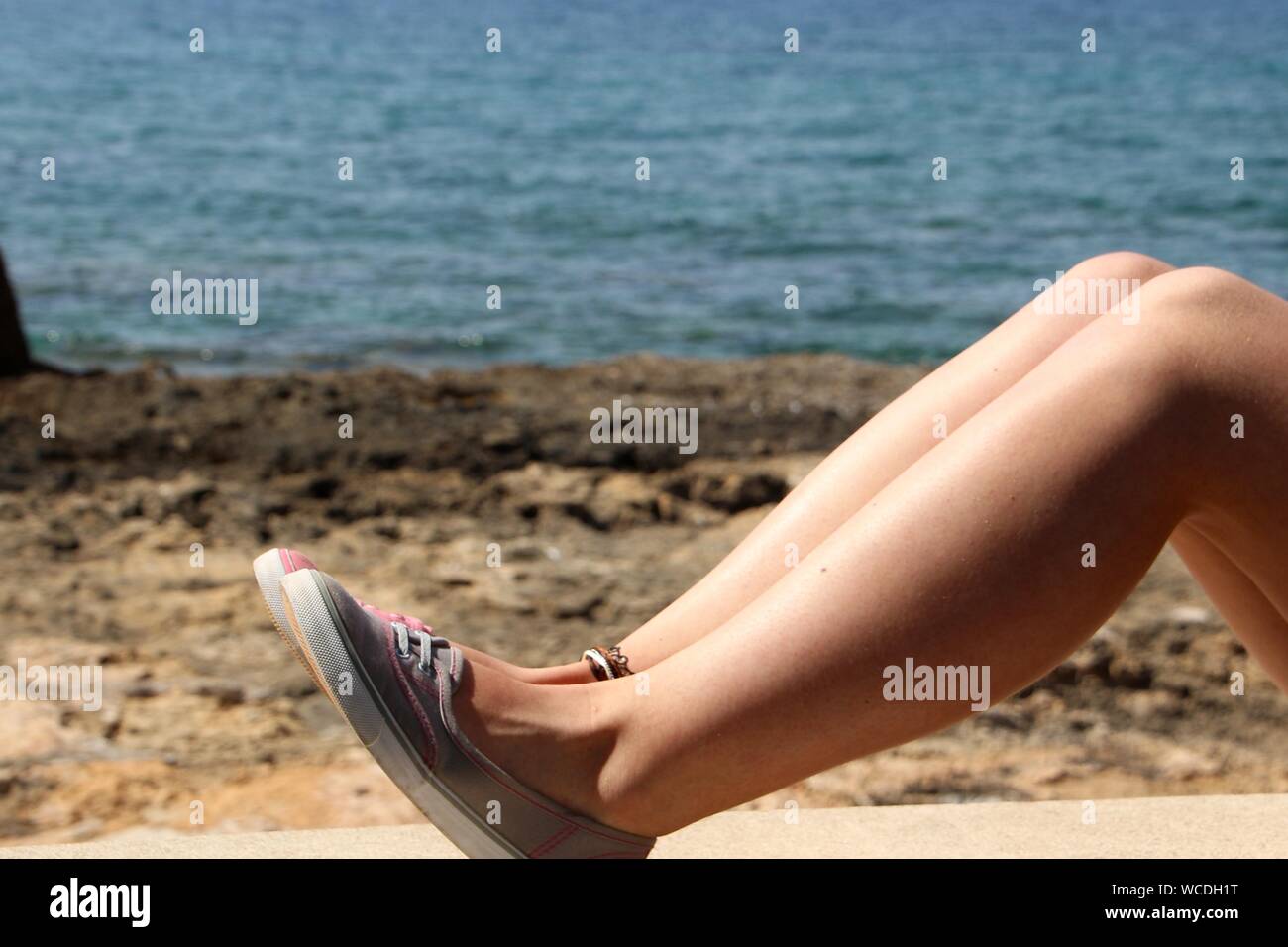 Legs woman on beach hi-res stock photography and images - Alamy