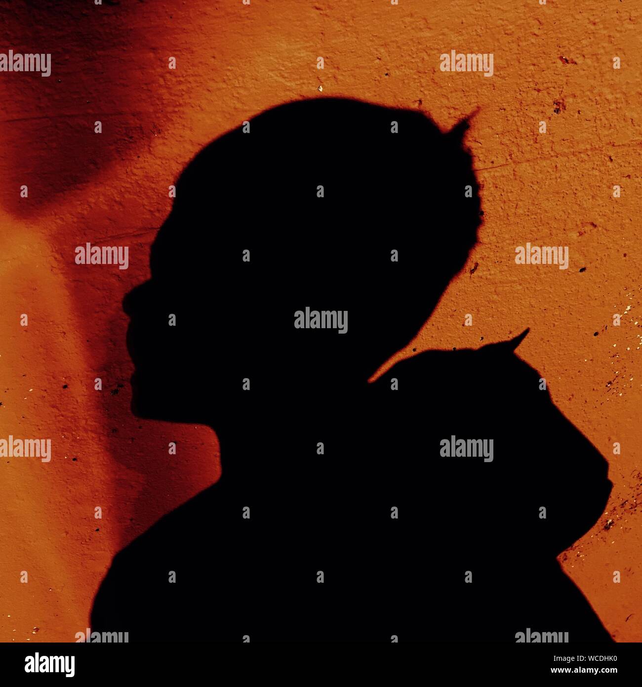 Boy wall standing shadow hi-res stock photography and images - Alamy