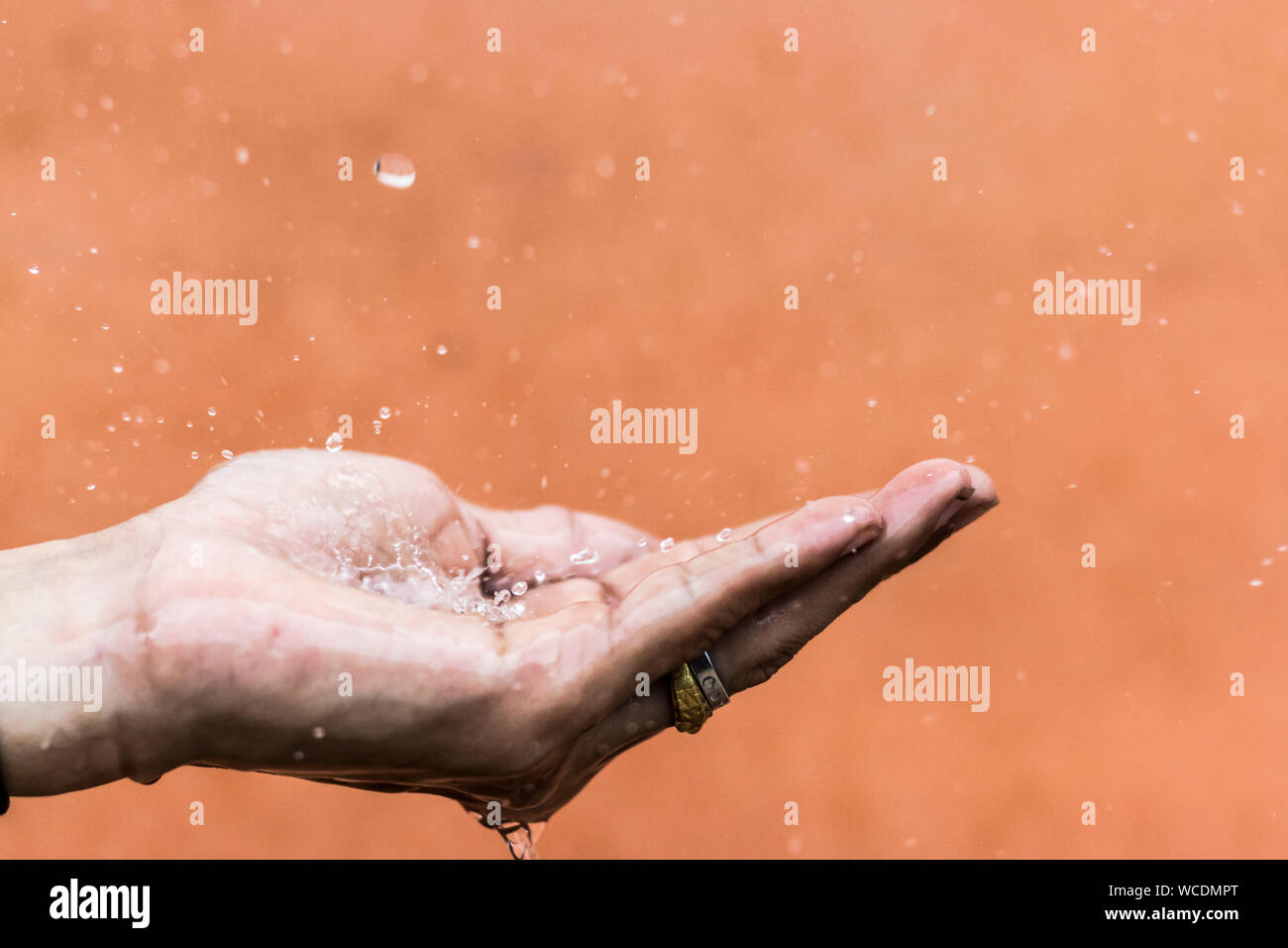 Human hand splashing water hi-res stock photography and images - Alamy