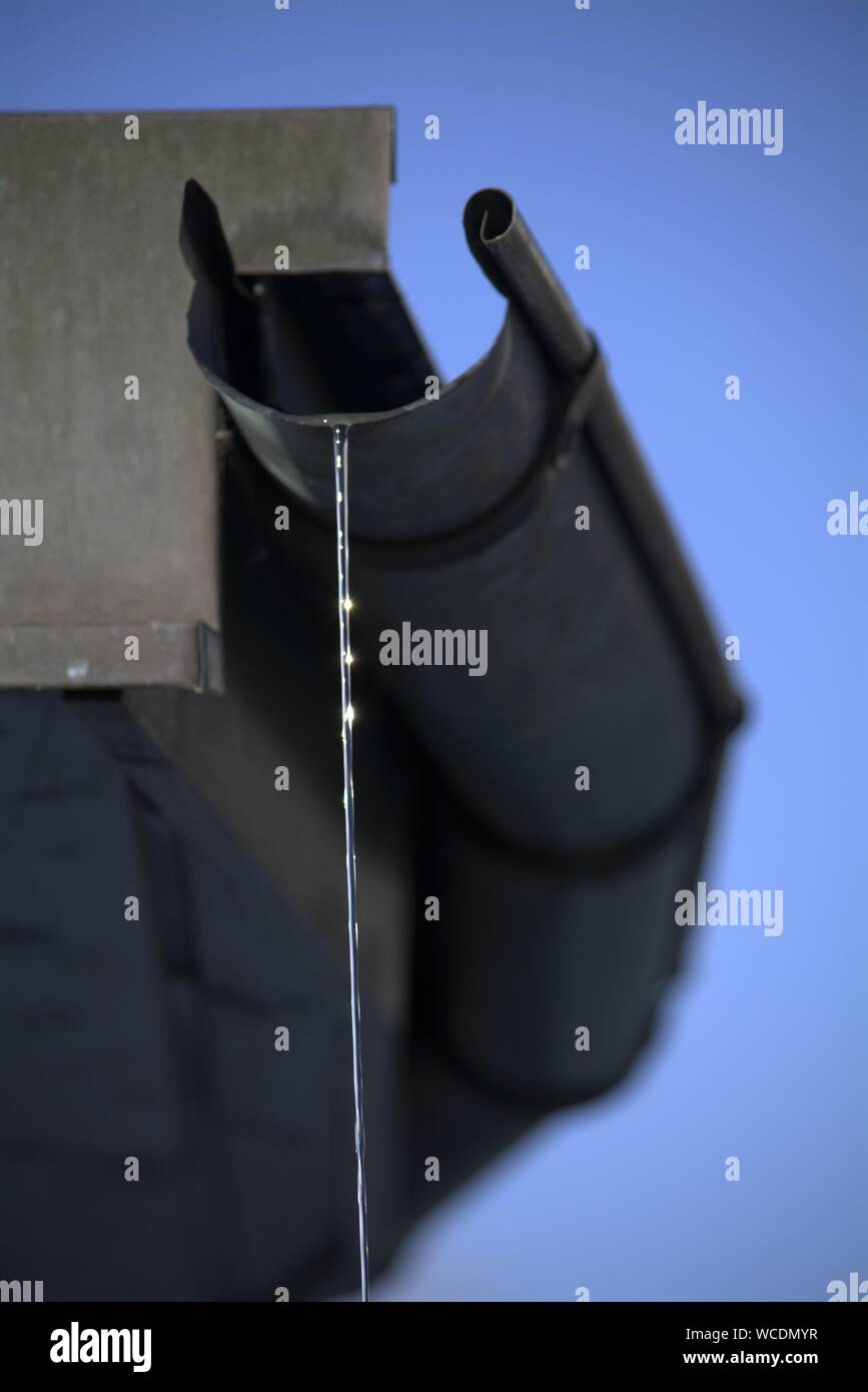 Rain falling from gutter hi-res stock photography and images - Alamy