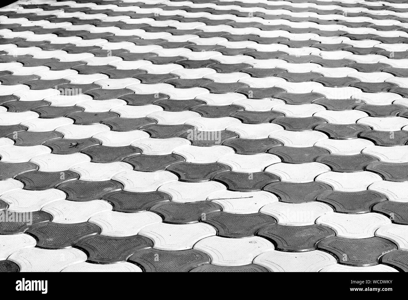View of footpath tiles in monochrome Stock Photo - Alamy