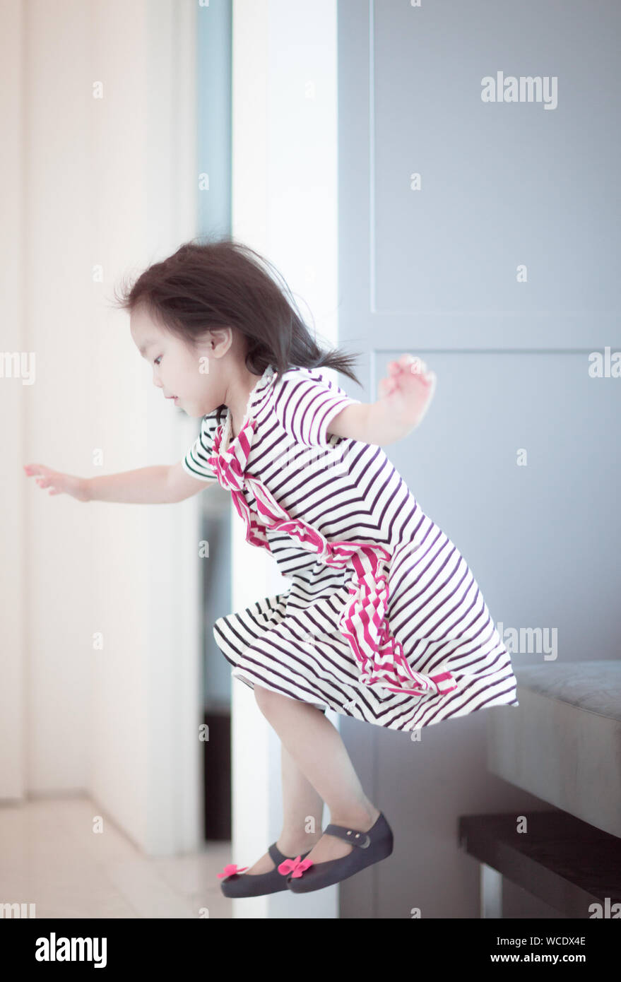 Indian girl jumping hi-res stock photography and images - Alamy
