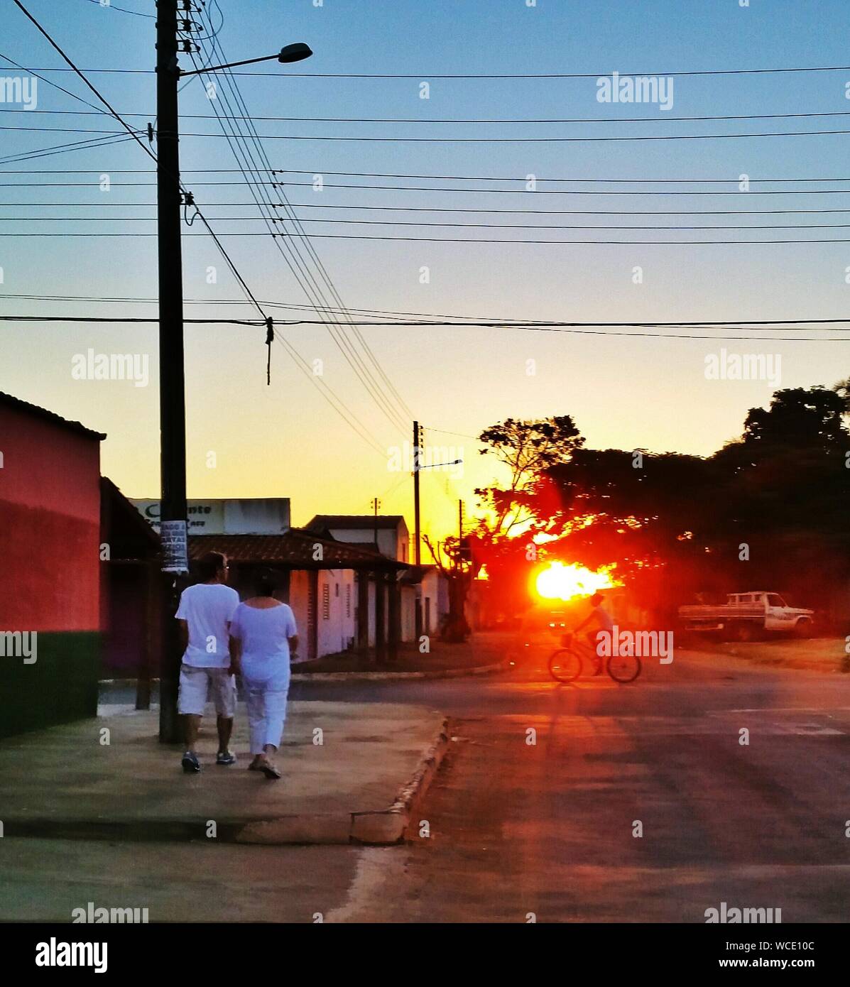 Two people walking at sunset hi-res stock photography and images - Alamy