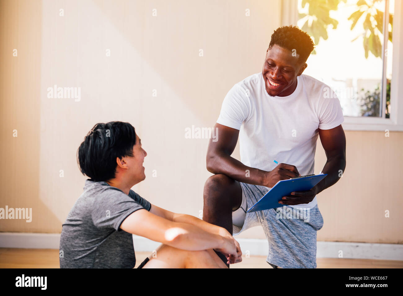 African american male gym trainer hi-res stock photography and images ...