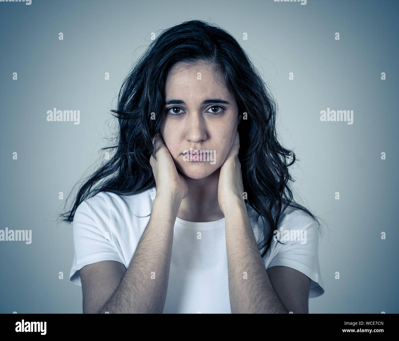 Portrait of young sad latin woman suffering depression looking ...