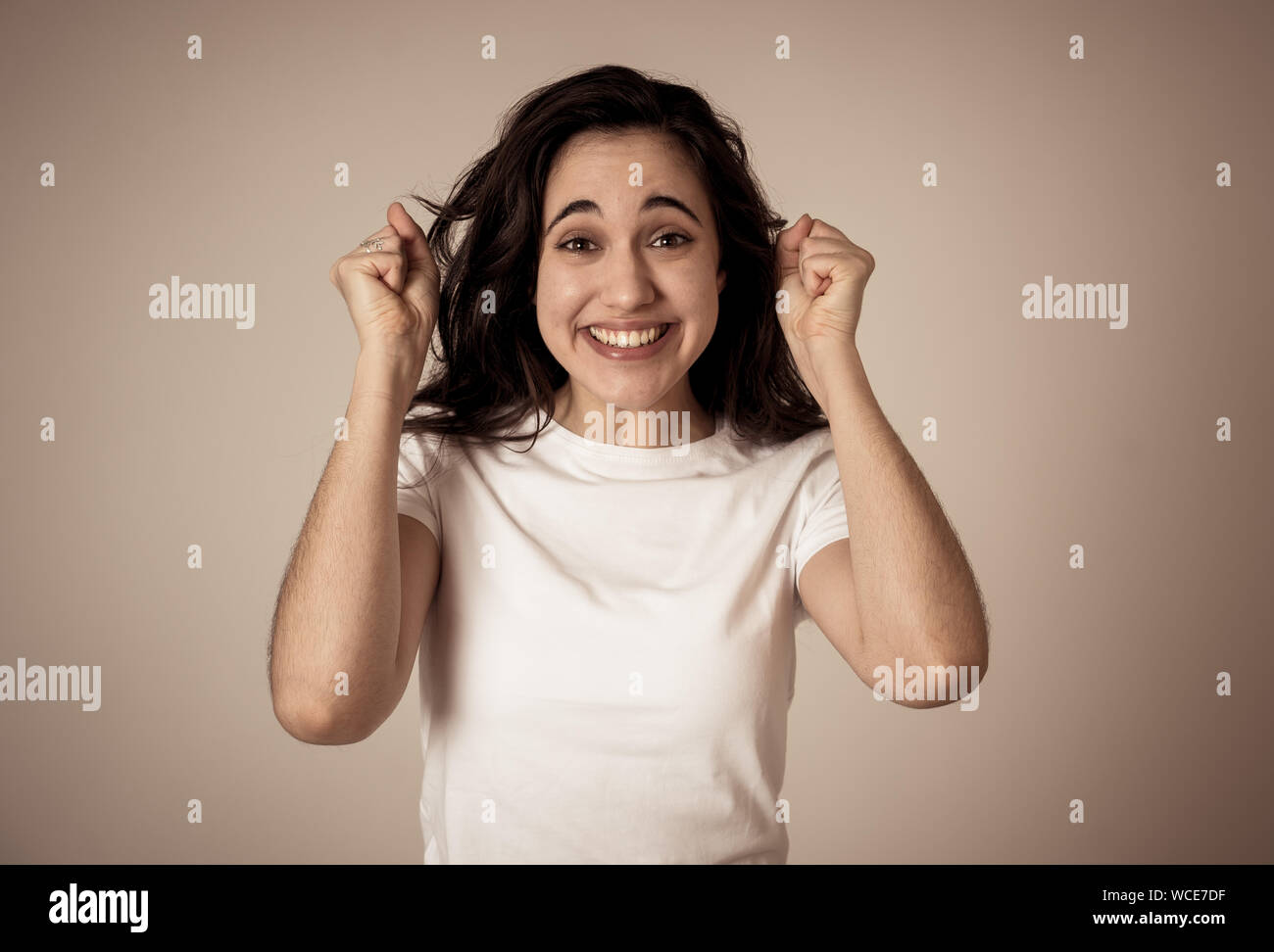 Young attractive latin woman celebrating success winning or feeling ...