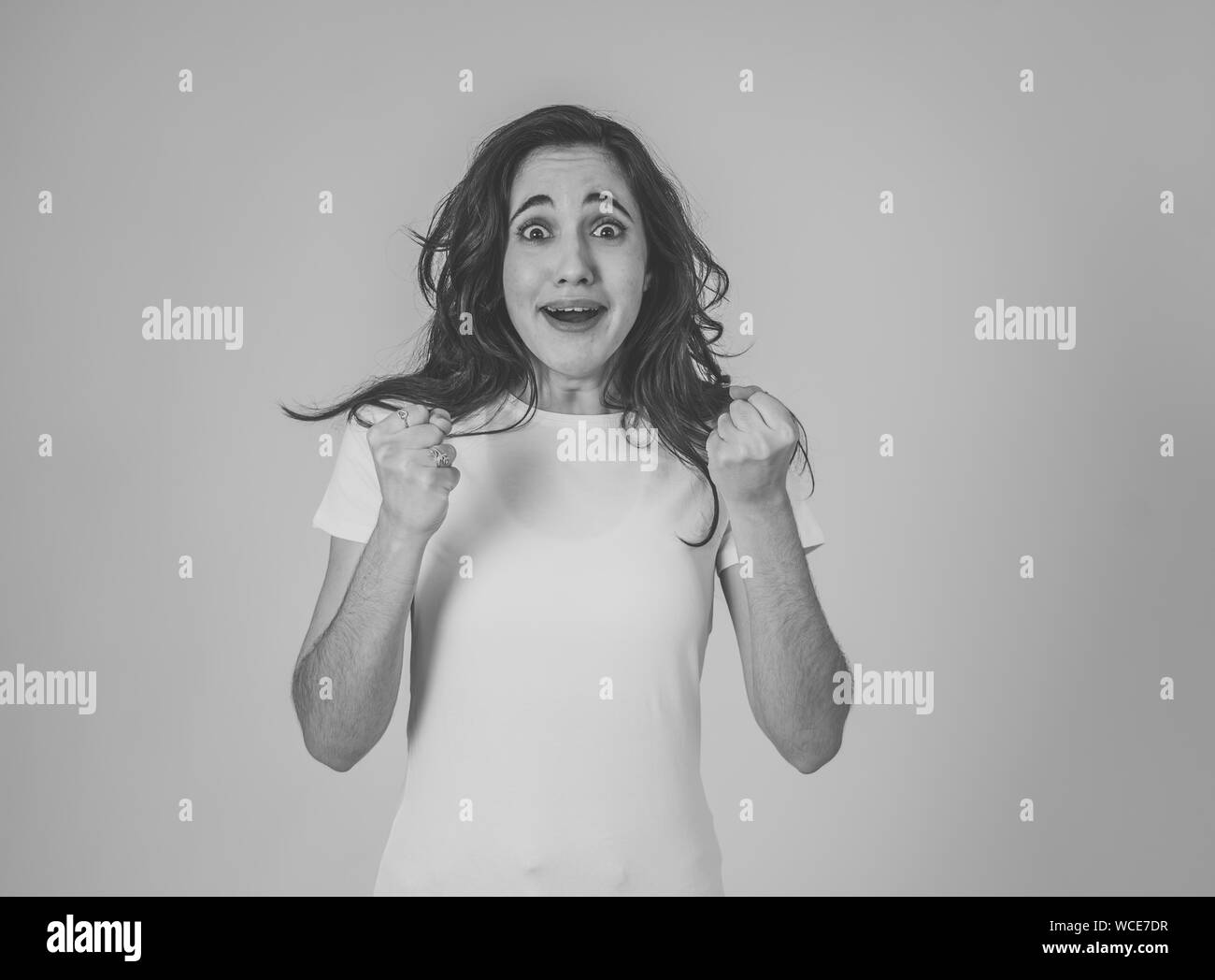 Young attractive latin woman celebrating success winning or feeling ...