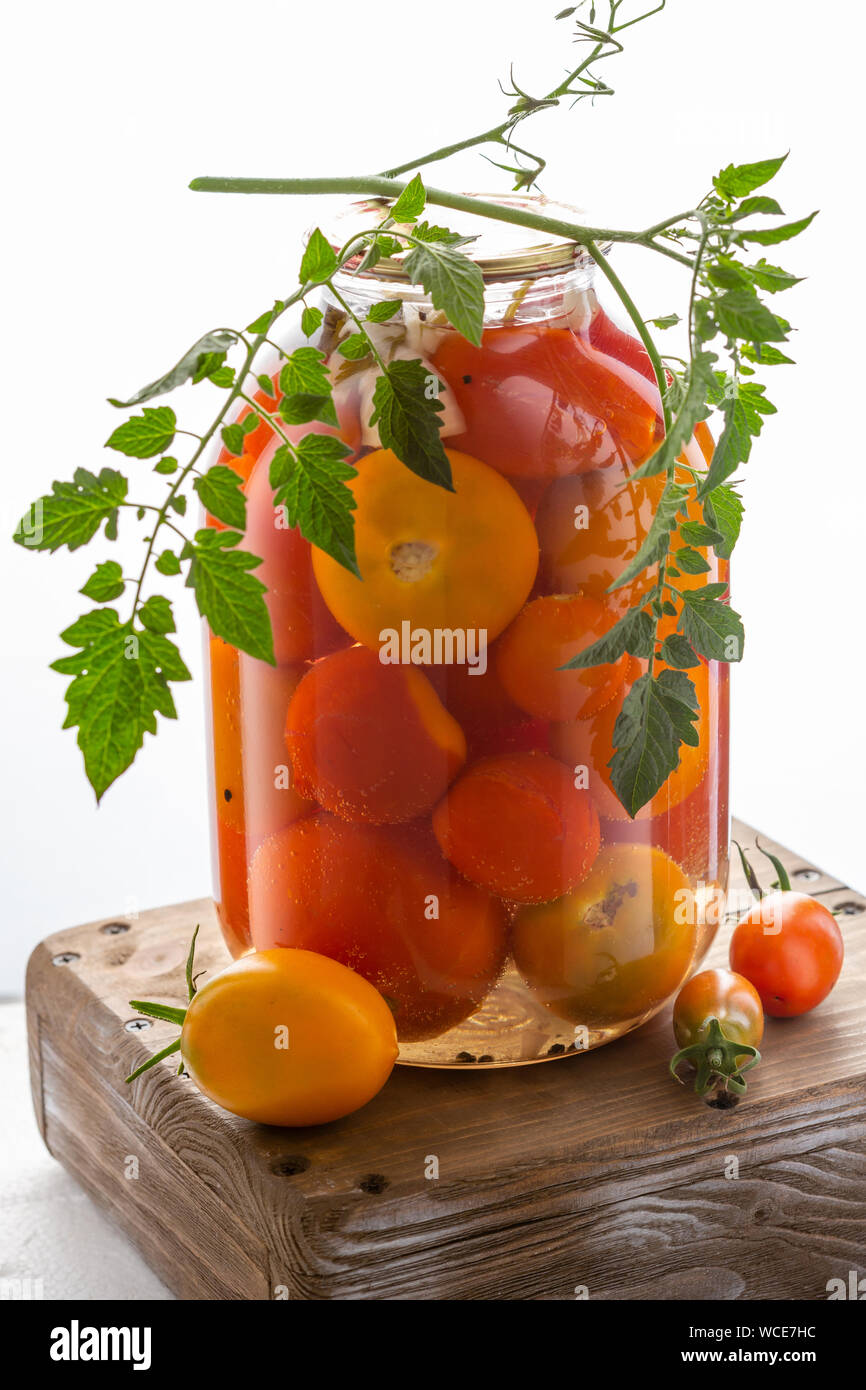 Homemade preservation of tomatoes in jar Stock Photo - Alamy