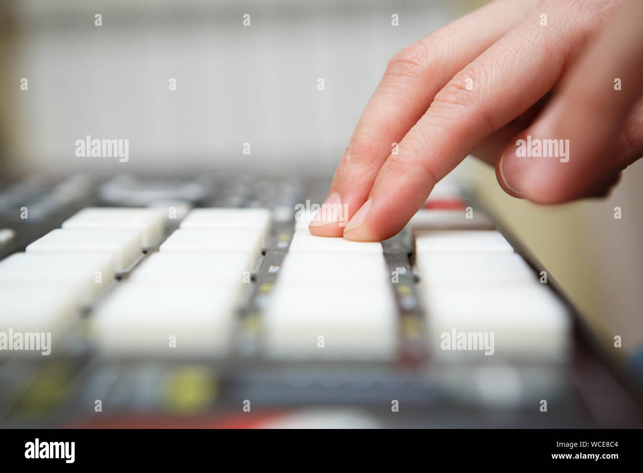 Beat maker producing new track with professional midi controller device ...