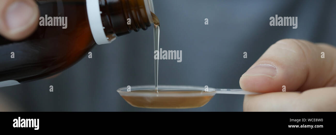 Male hand of man in hospital pours cough Stock Photo - Alamy