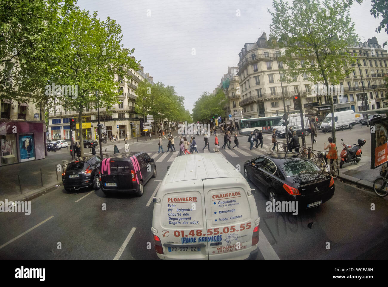 Streets of Paris with pedestrians and traffic Stock Photo - Alamy