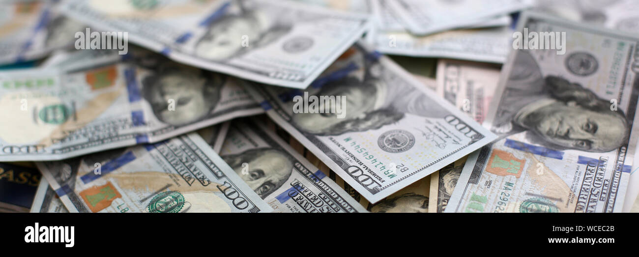 Big pile of US money lying down in random order Stock Photo - Alamy