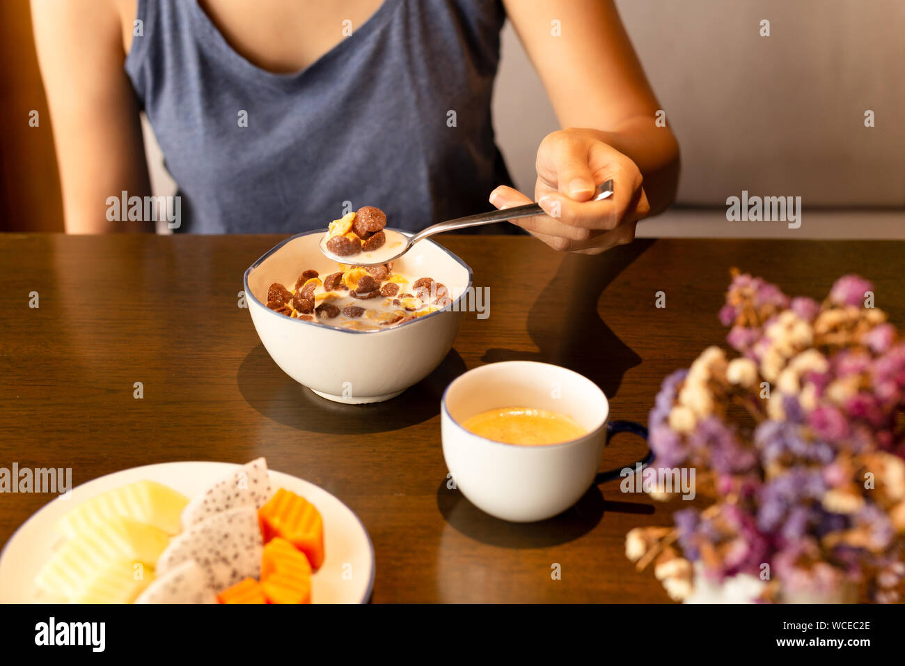 Attractive woman eating corn flakes hi-res stock photography and images ...