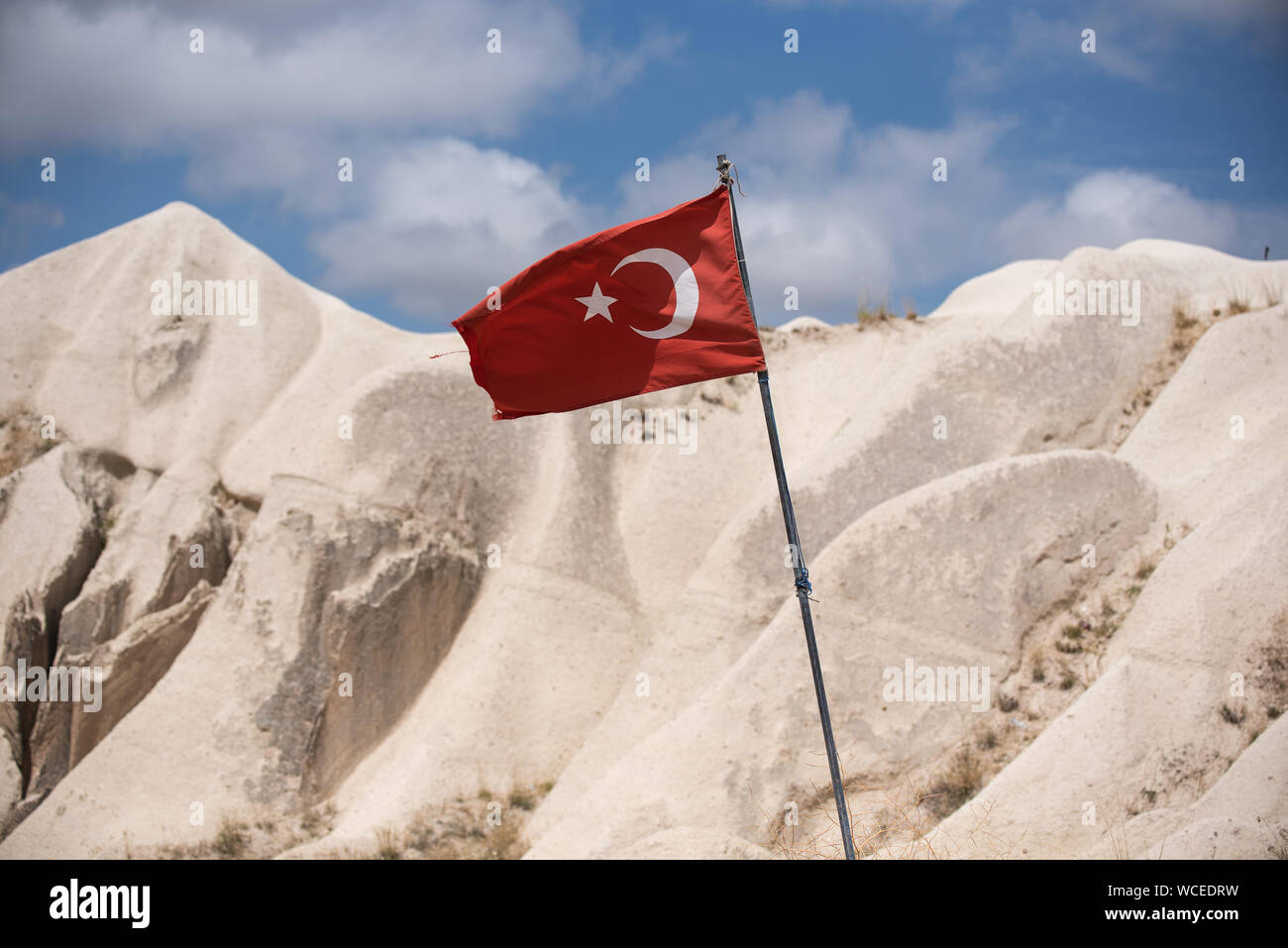 Turkish flag with typical tuff rock formations of the Cappadocia in ...