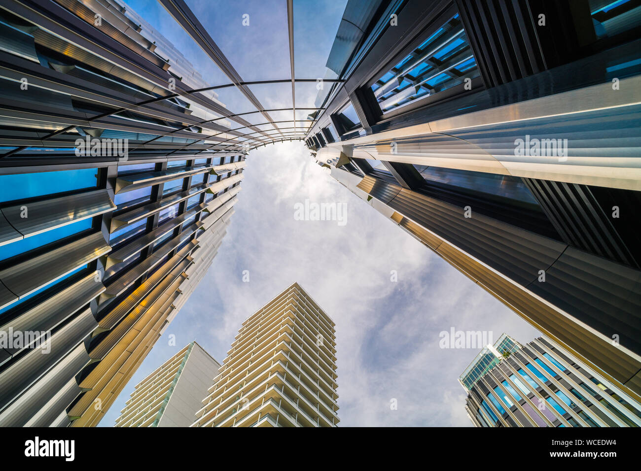 Modern skyscrapers in metropolis center. High-rise buildings on blue ...