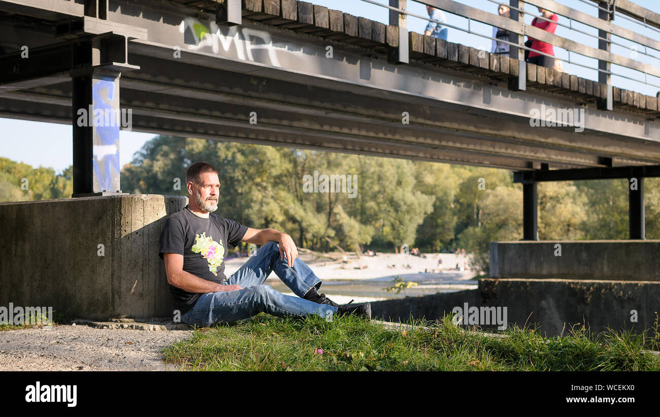Man Sitting Under Bridge High Resolution Stock Photography and Images ...