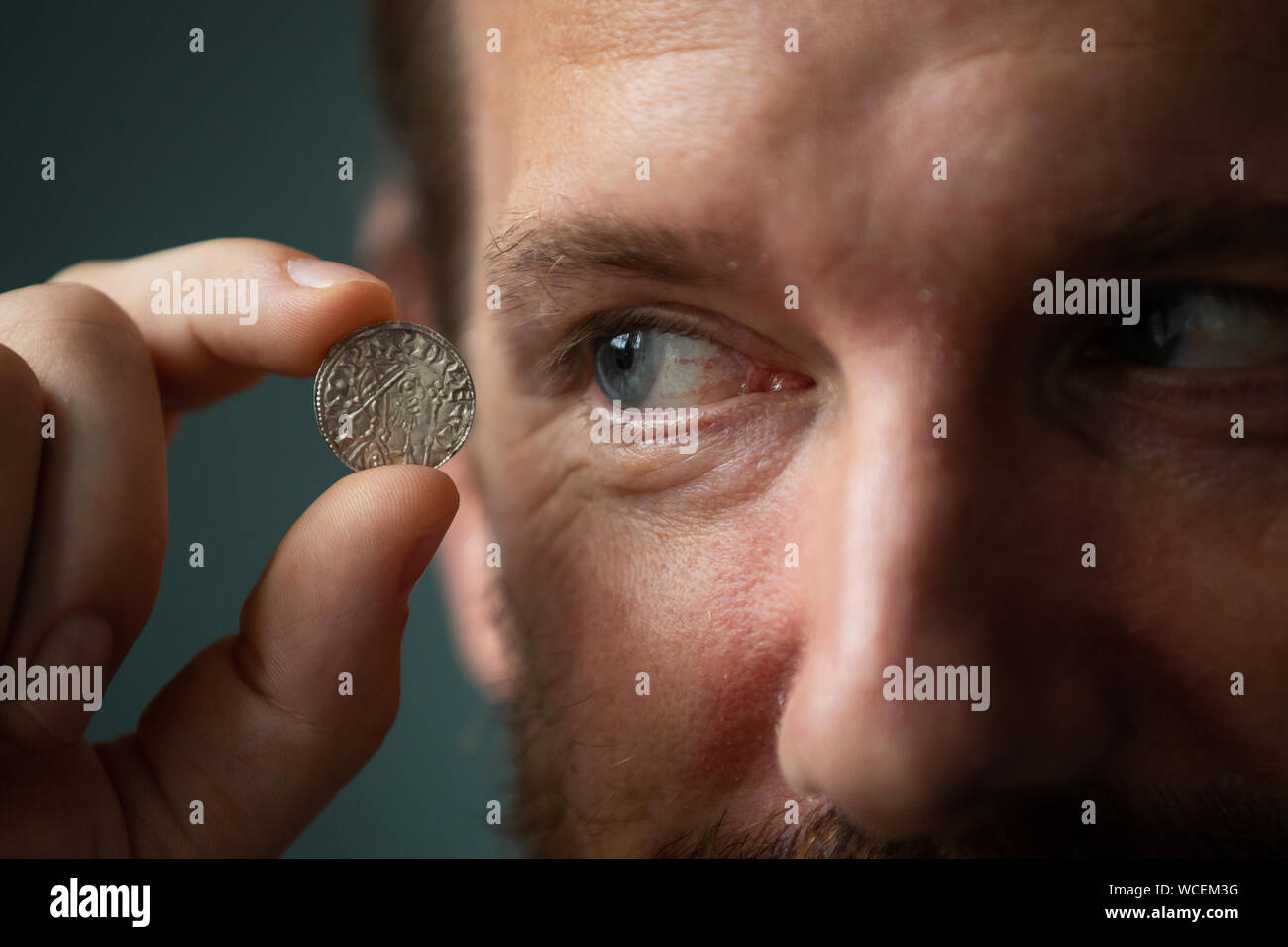Ian Richardson, Treasure Registrar at the British Museum holding a rare ...