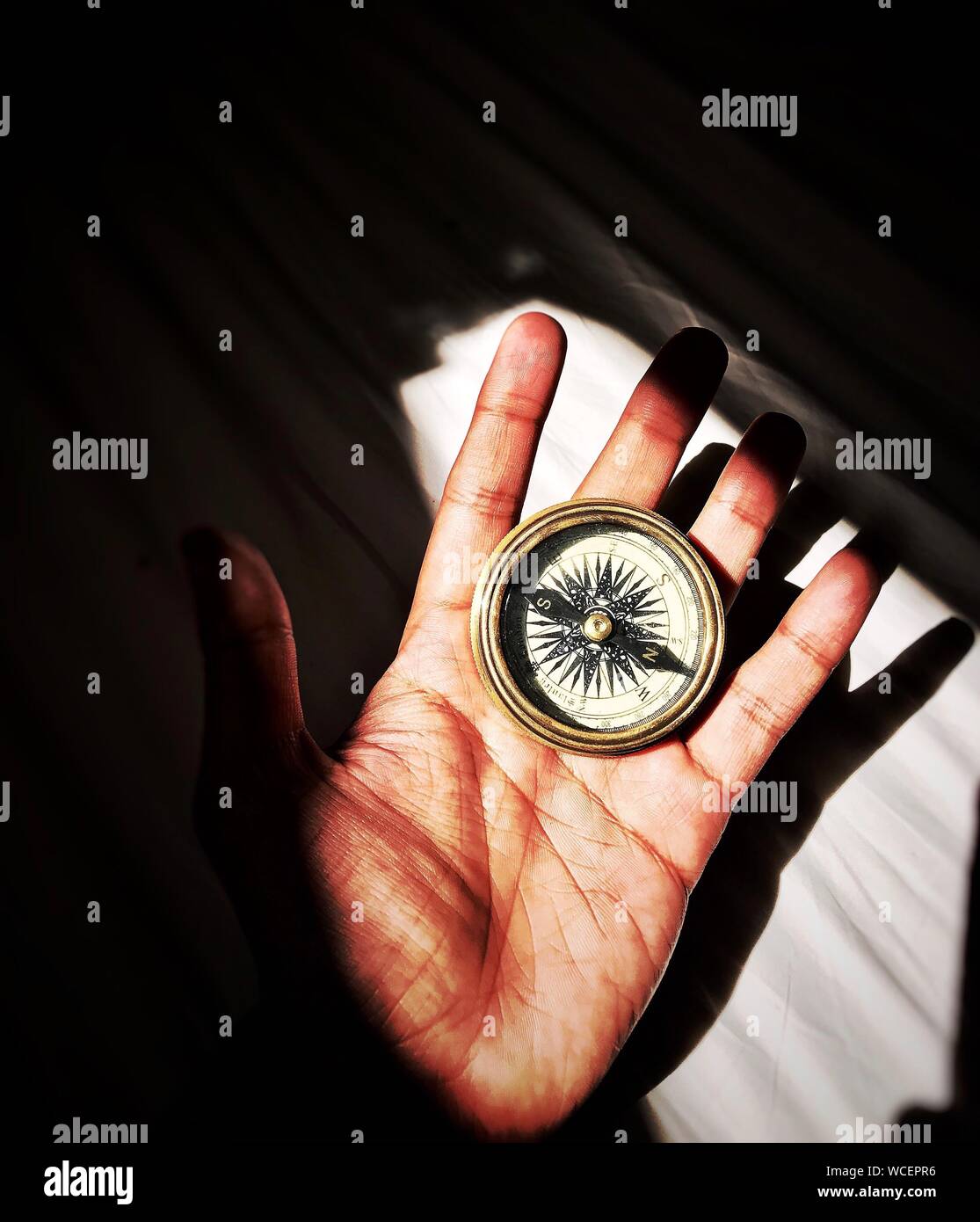 Person with compass hi-res stock photography and images - Alamy