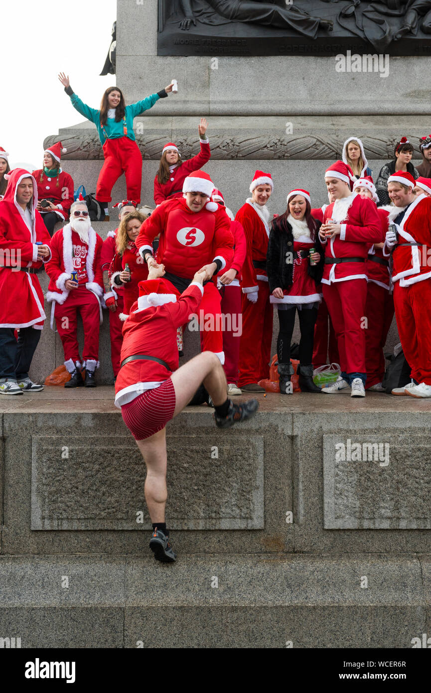 Hundreds of Santas flood Trafalgar Square for the annual, global ...