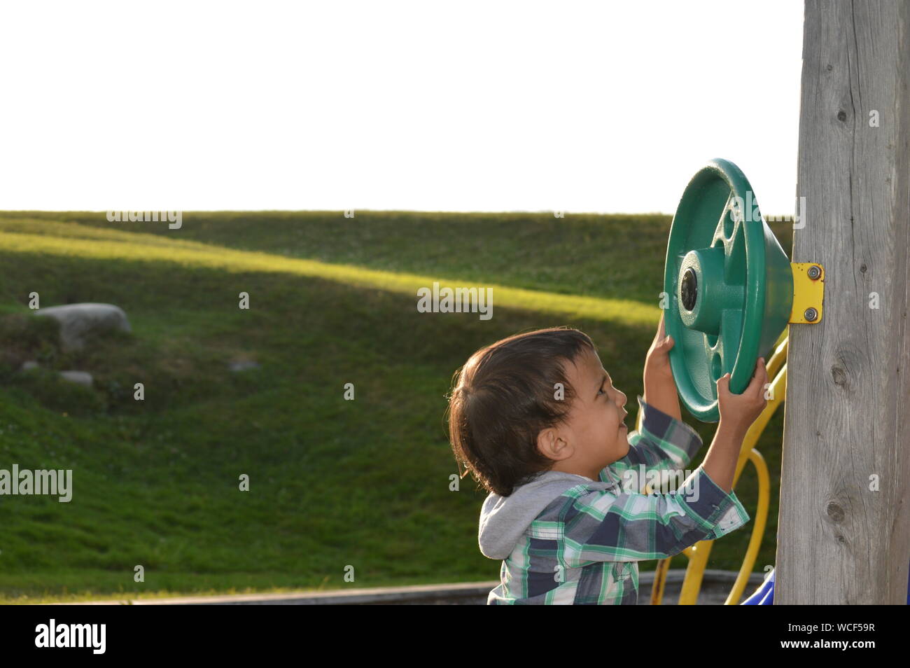 Boy playing wheel hi-res stock photography and images - Alamy
