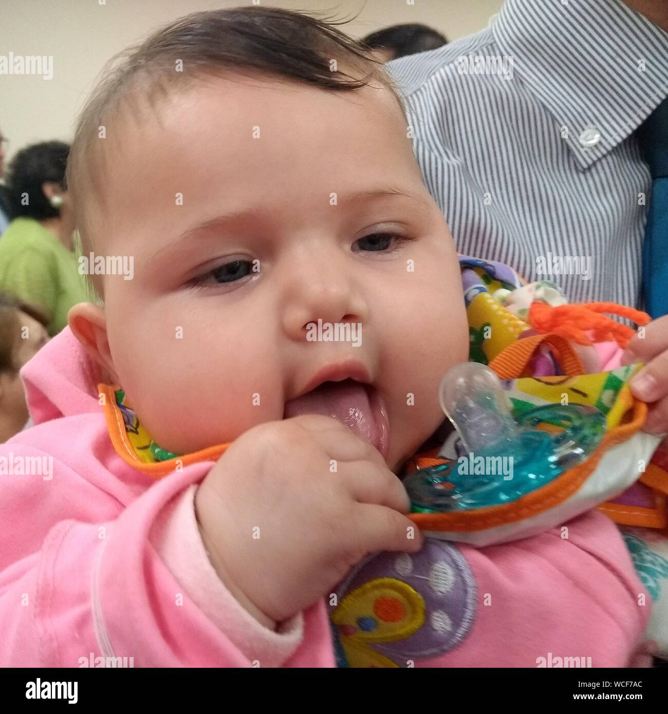 Girl holding pacifier hi-res stock photography and images - Alamy