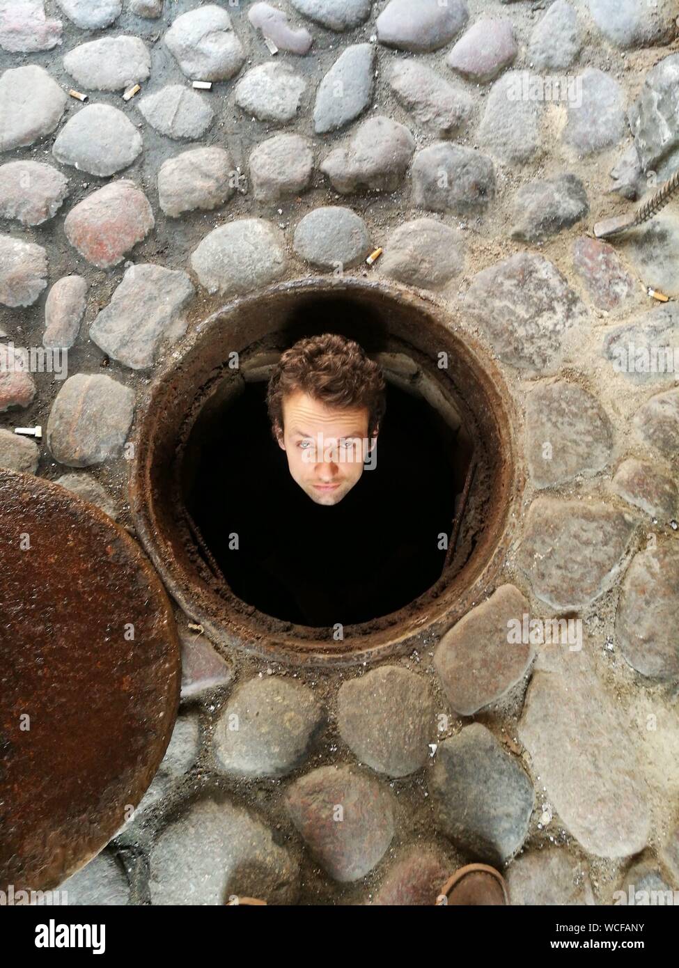 Man manhole hi-res stock photography and images - Alamy