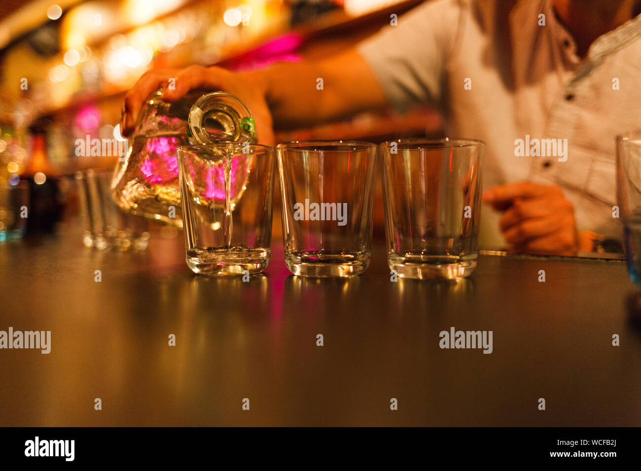 Bartender pouring bottle hi-res stock photography and images - Alamy