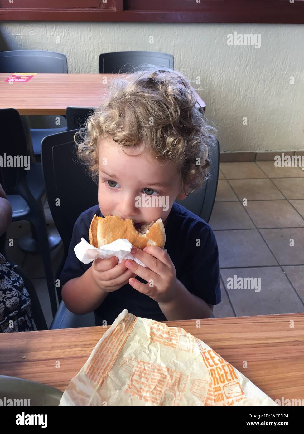 Boy eating snack hi-res stock photography and images - Alamy