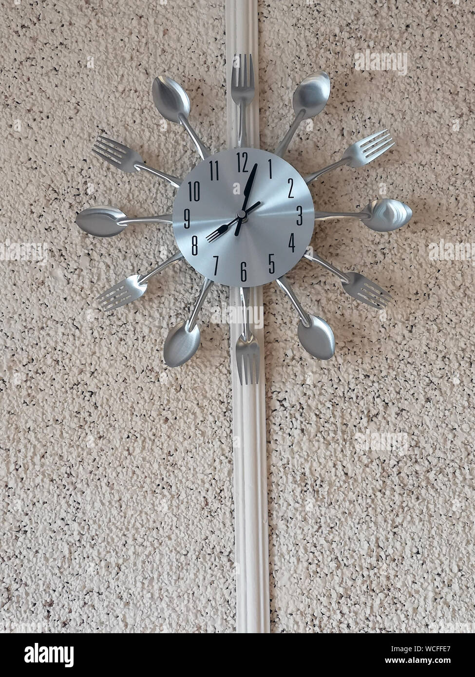 Kitchen decorative dersign clock witch spoons and forks Stock Photo - Alamy