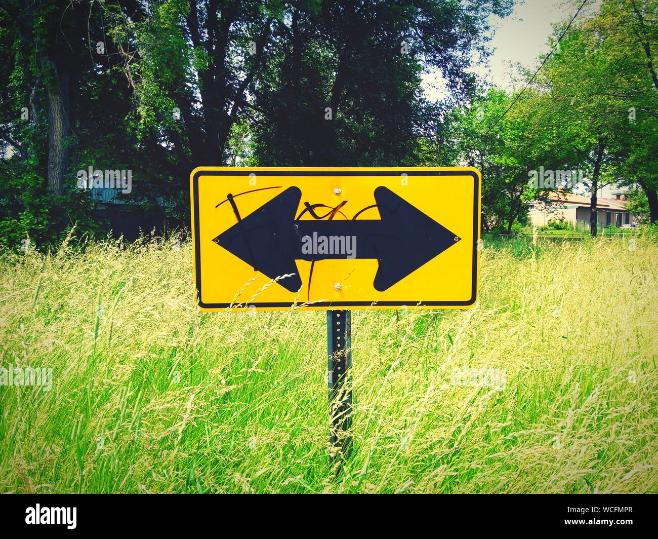 Yellow road arrows hi-res stock photography and images - Alamy